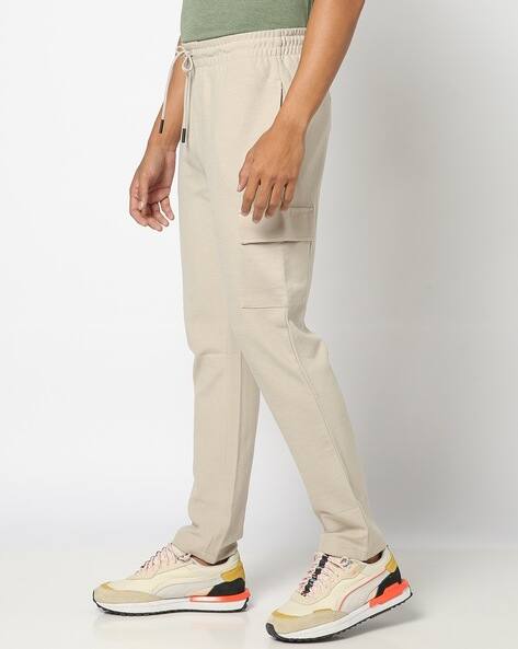 Buy Beige Track Pants for Men by YOUSTA Online | Ajio.com